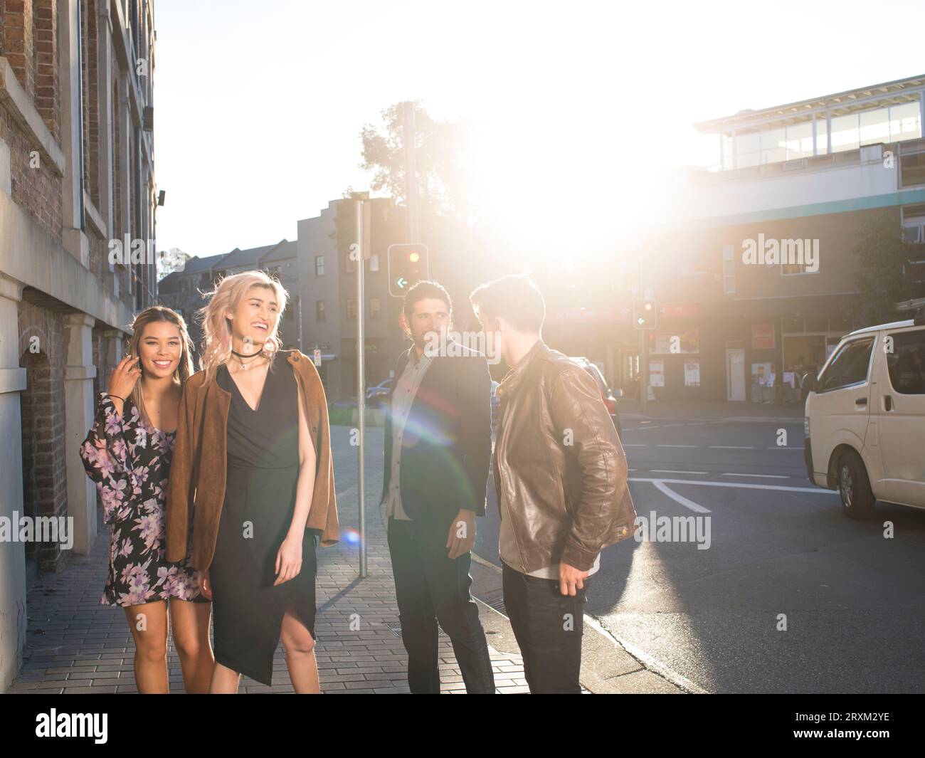 Mid adult woman and male friends on city street hi-res stock photography and images - Alamy