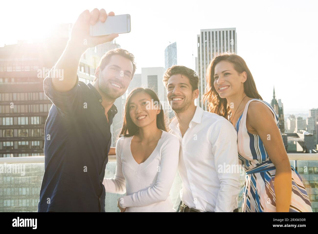 Friends taking selfie on balcony in New York City Stock Photo - Alamy