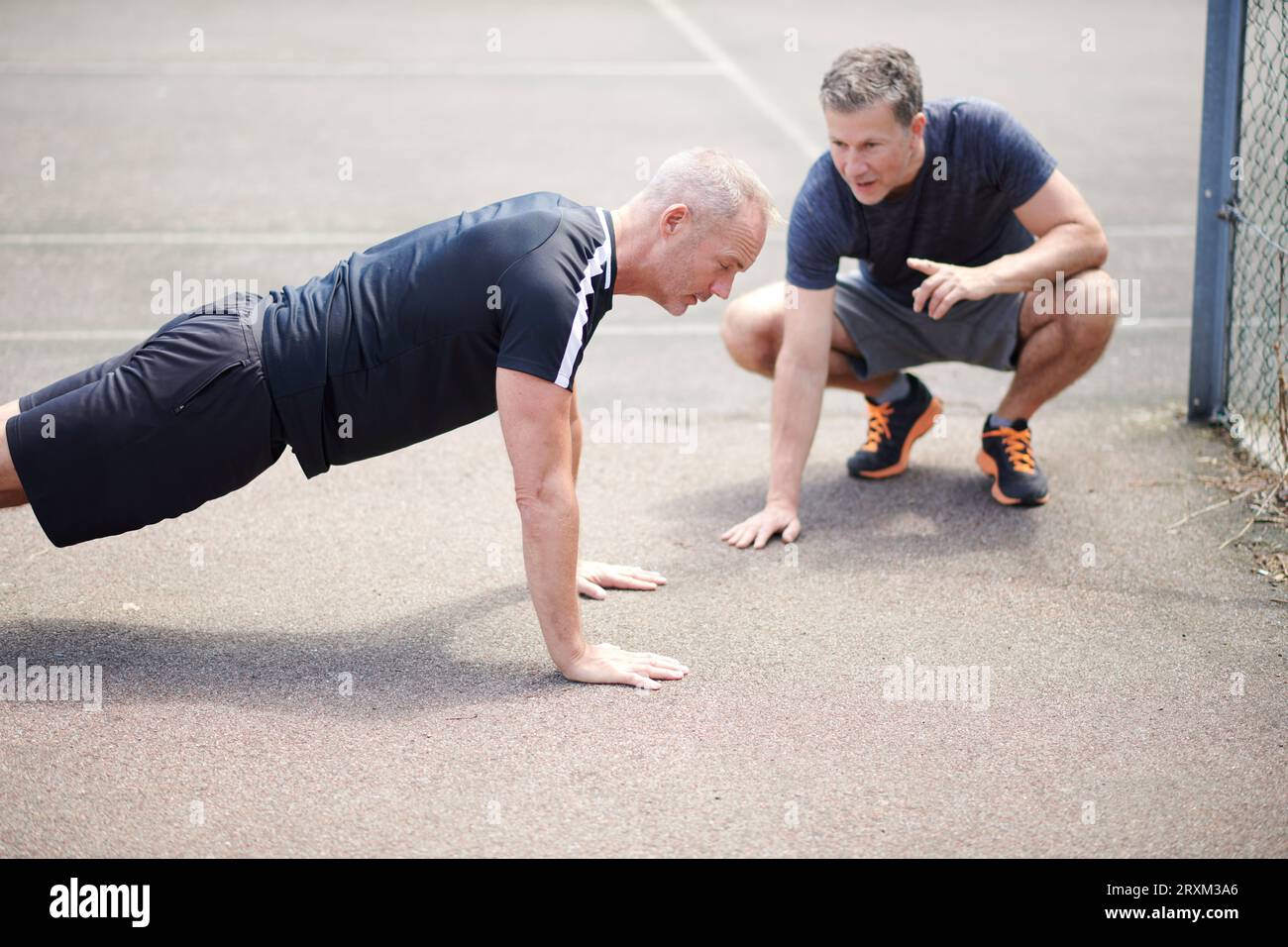 Mature men doing push-ups Stock Photo - Alamy