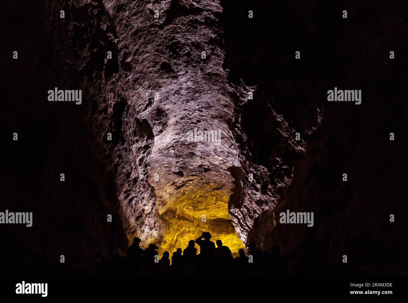 Silhouettes of people in cave Stock Photo - Alamy