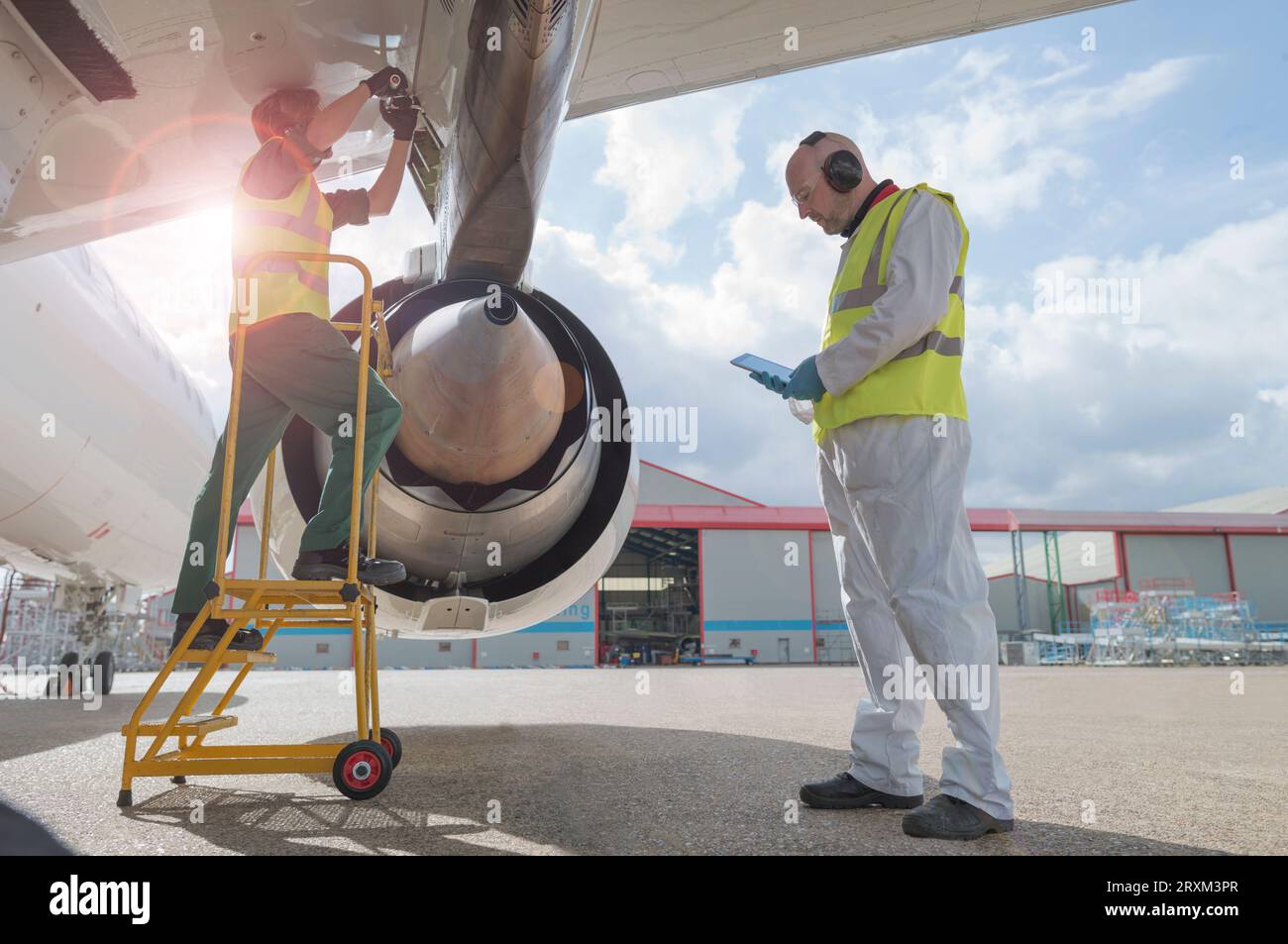 Standing holding working teamwork aerospace industry hi-res stock ...