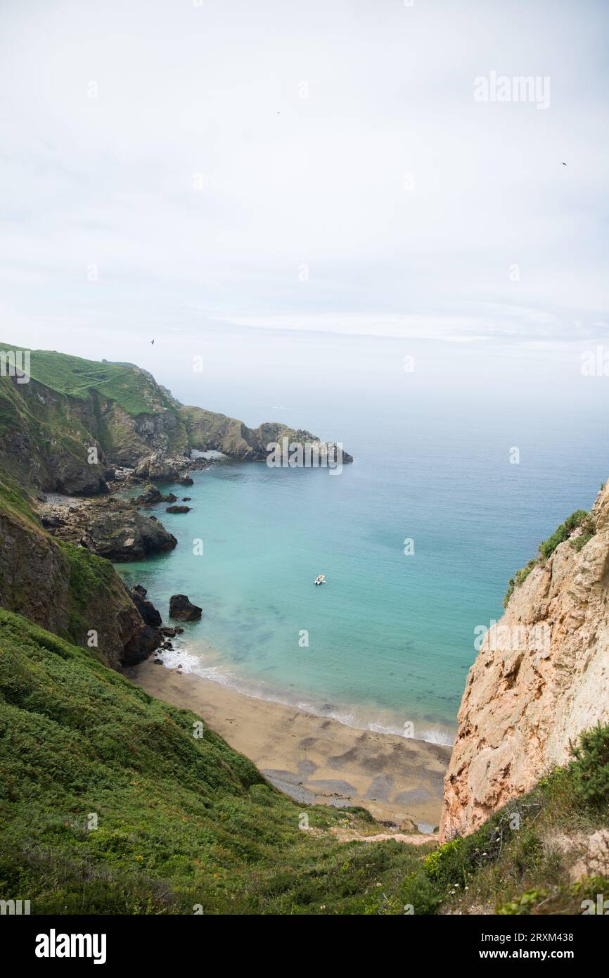 Beach between cliffs Stock Photo - Alamy
