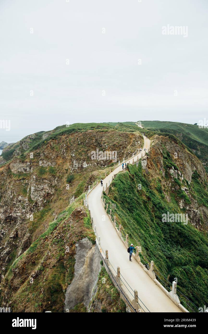 Female tourist walks on grass hi-res stock photography and images - Alamy