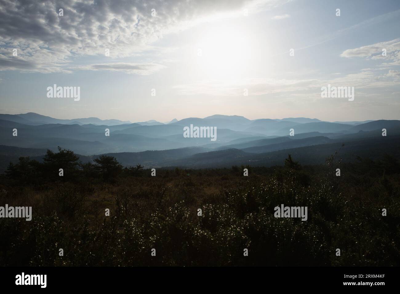 Landscape of hills in shadow Stock Photo - Alamy