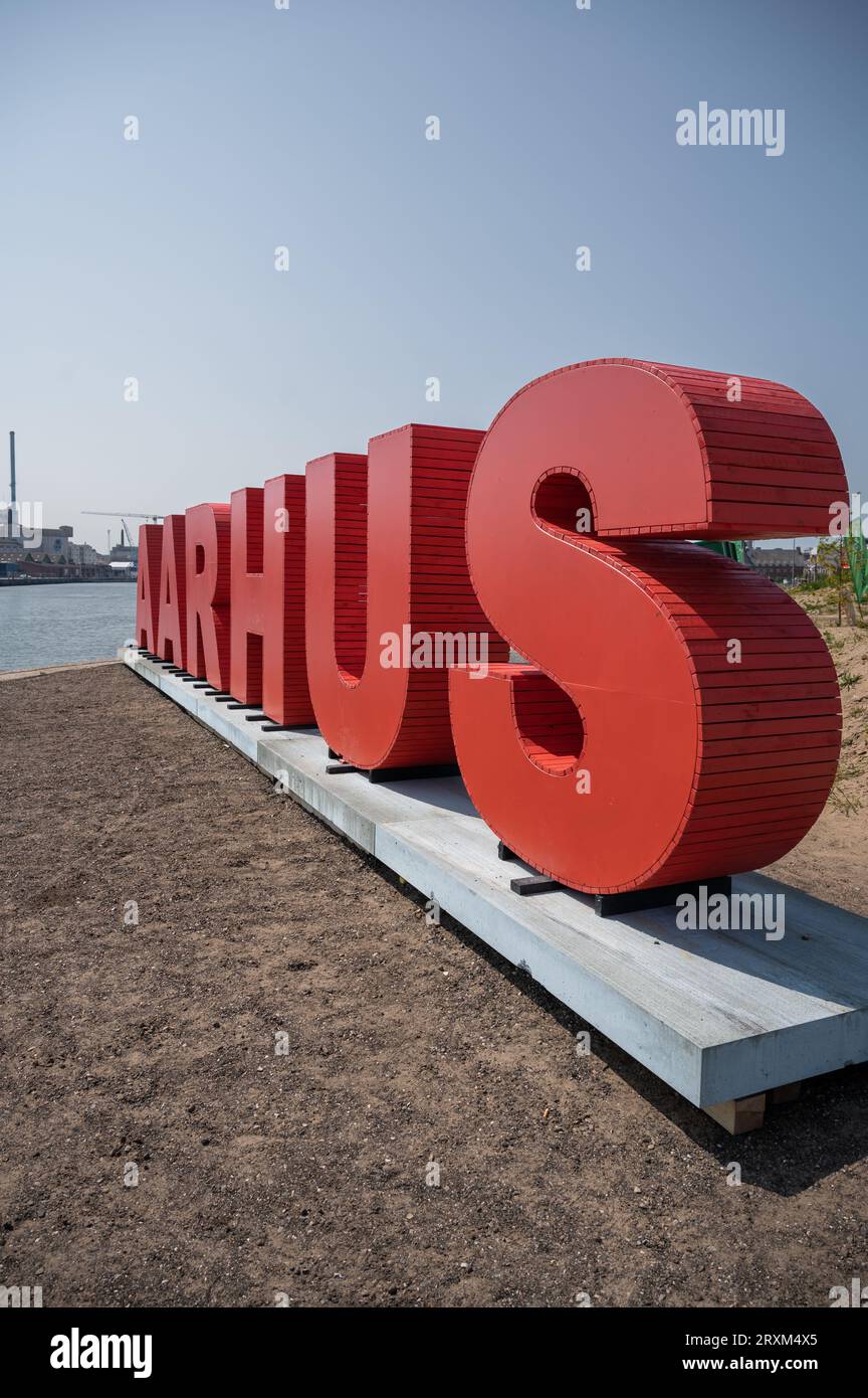 Red AARHUS Sign with big letters at the promenade near the port of ...