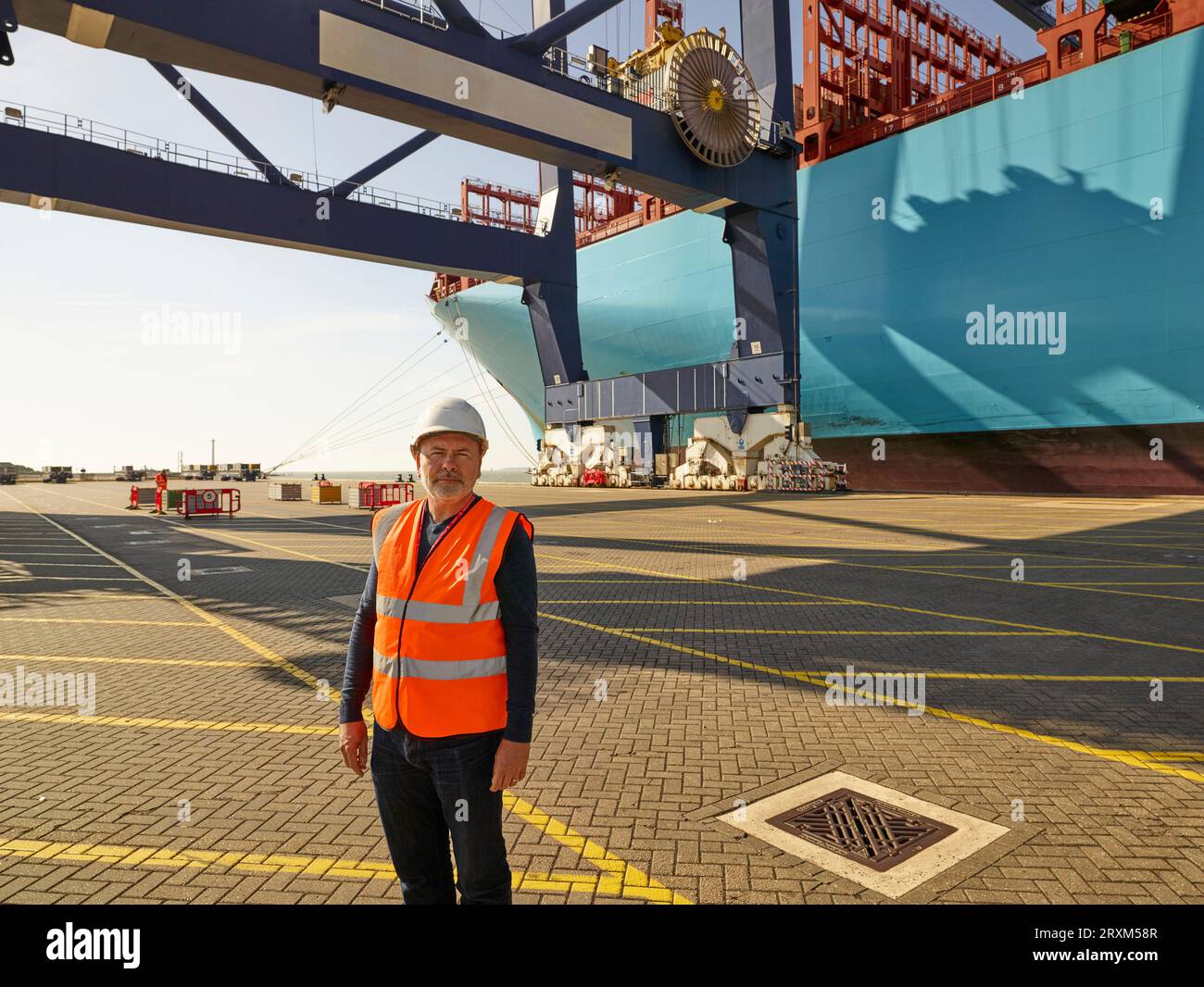 Dock worker by cargo ship at Port of Felixstowe, England Stock Photo ...