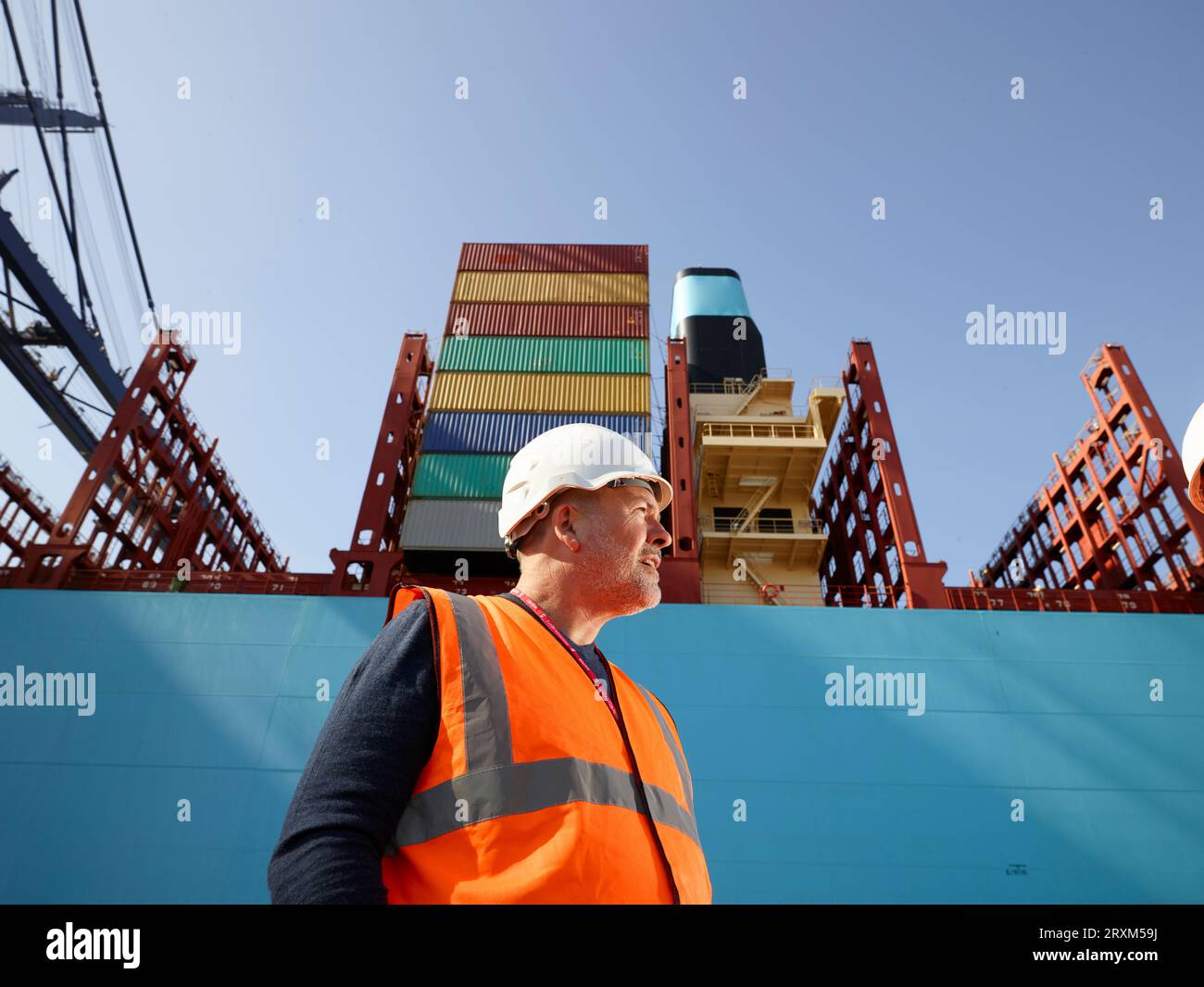 Dock worker by cargo ship at Port of Felixstowe, England Stock Photo ...