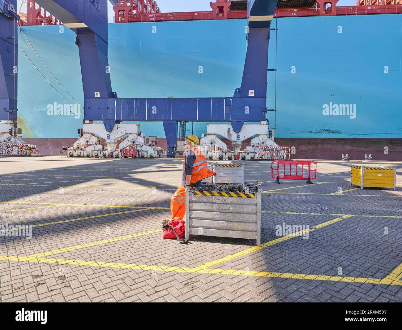 Dock worker by cargo ship at Port of Felixstowe, England Stock Photo ...