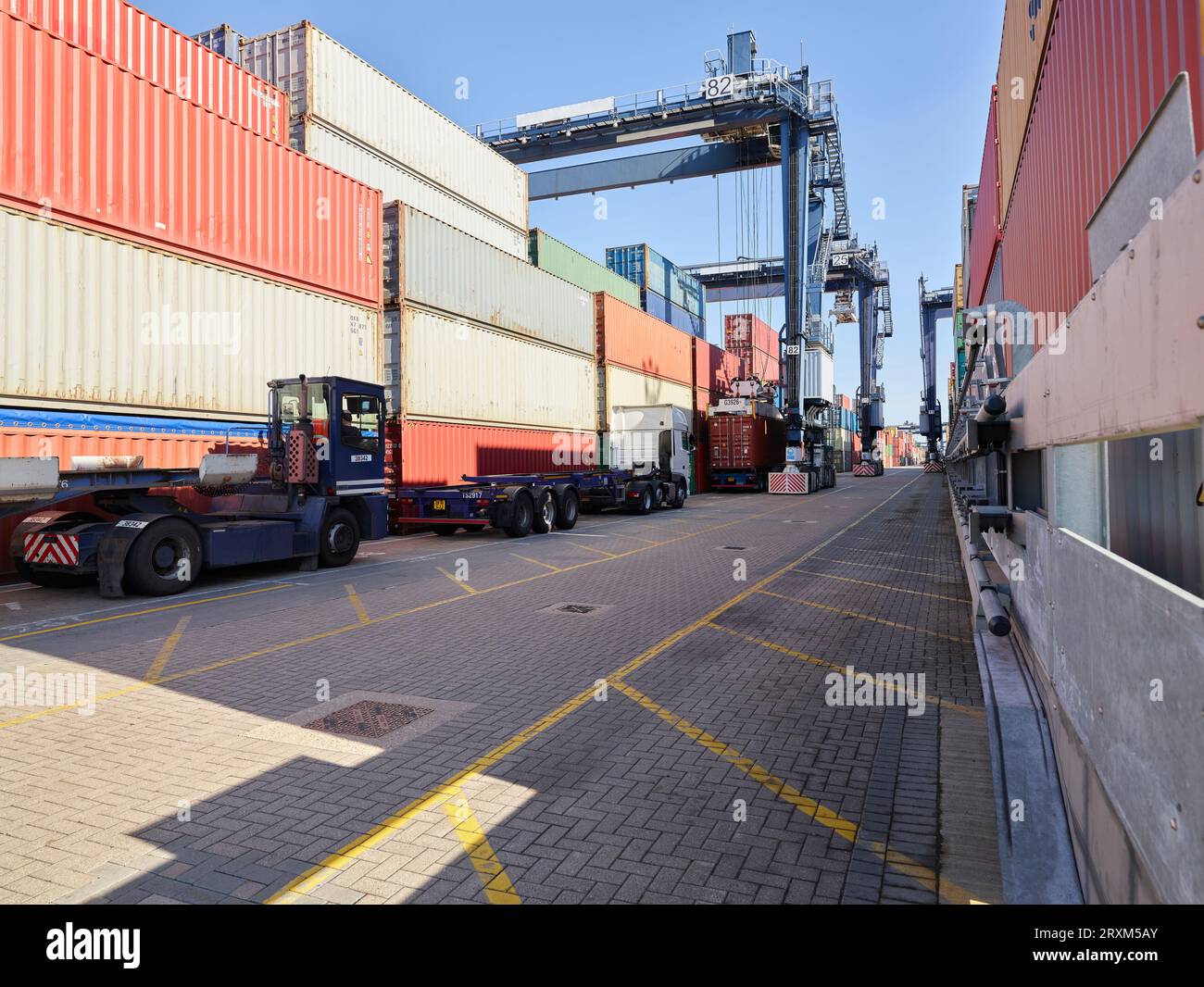 Trucks and cargo containers at Port of Felixstowe, England Stock Photo ...