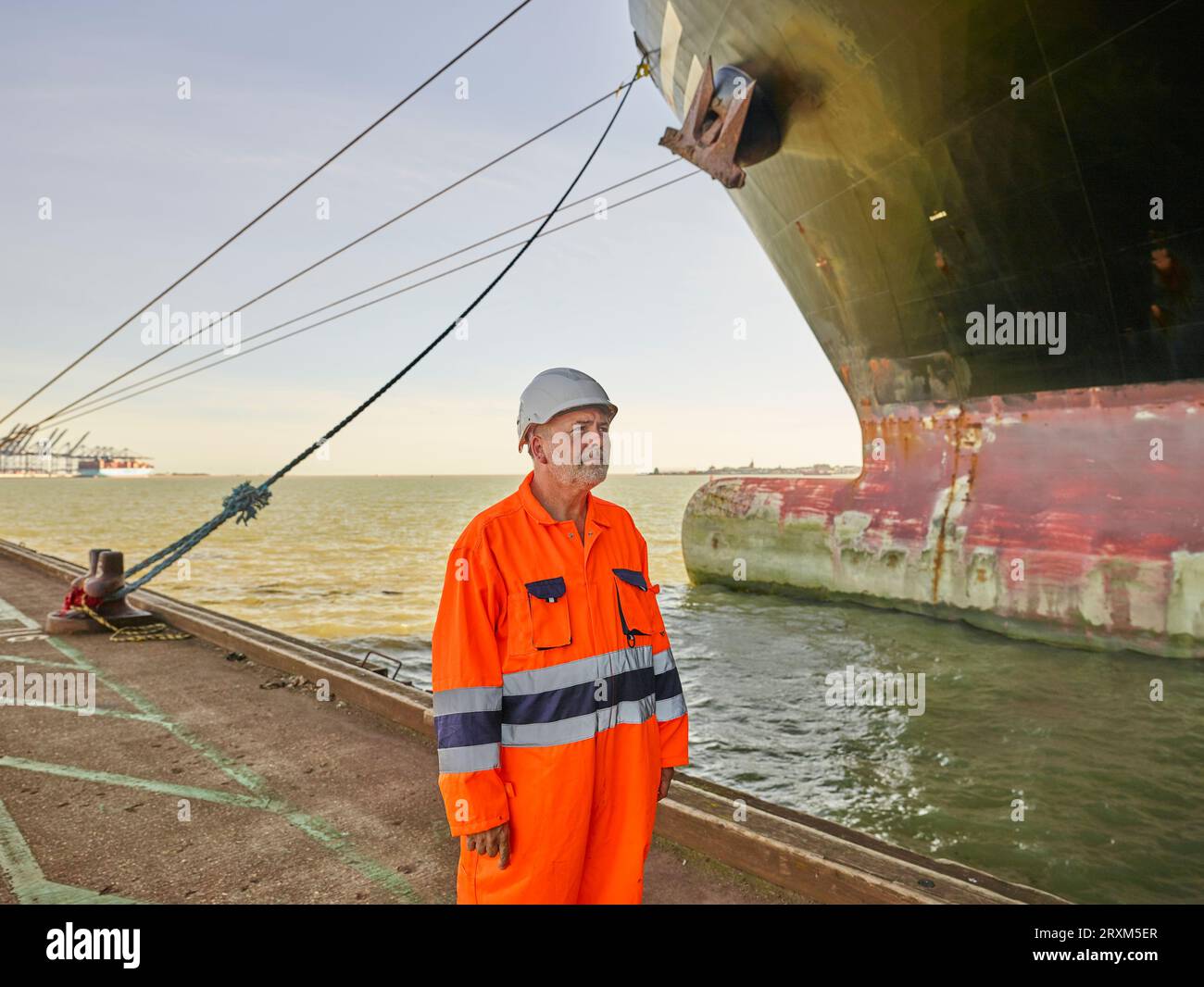 Dock worker by cargo ship at Port of Felixstowe, England Stock Photo ...