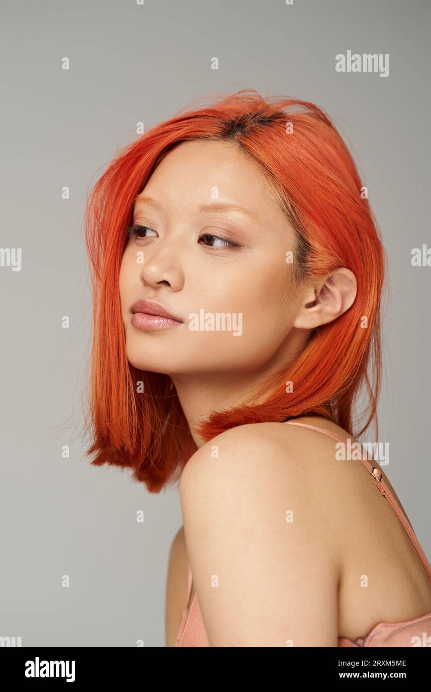 portrait of sophisticated young asian woman with perfect skin and red ...