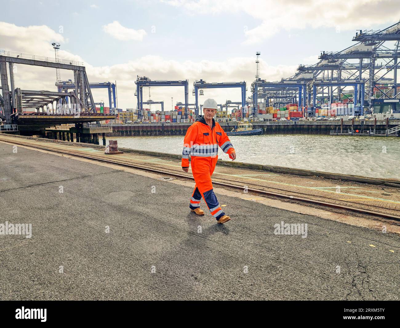 Dock worker walking at Port of Felixstowe, England Stock Photo - Alamy