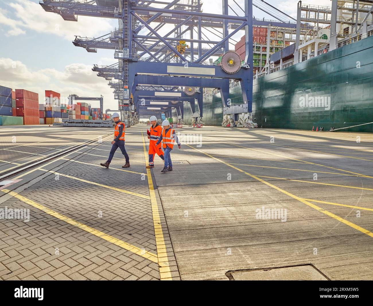 Dock workers beside cargo ship at Port of Felixstowe, England Stock ...