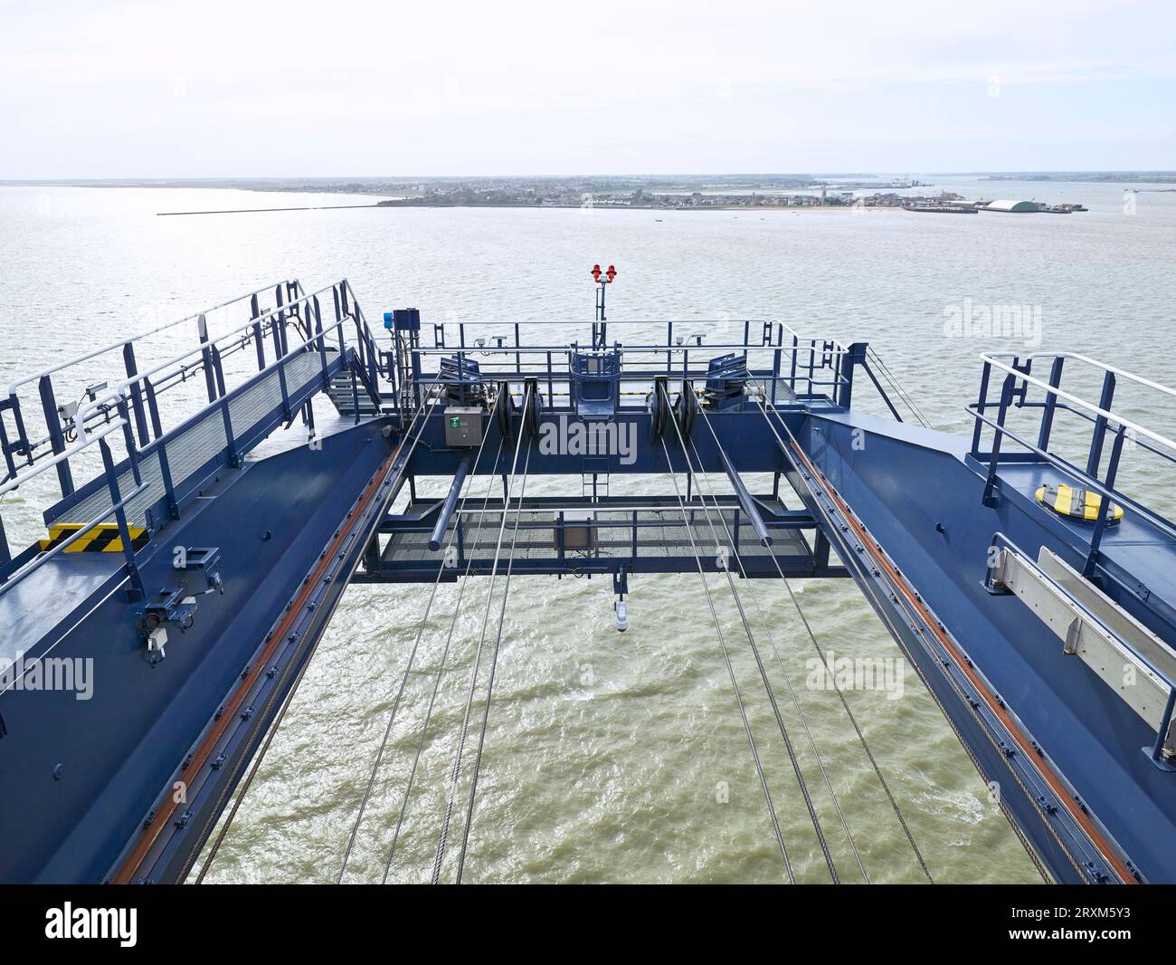 Dock crane above sea Stock Photo - Alamy