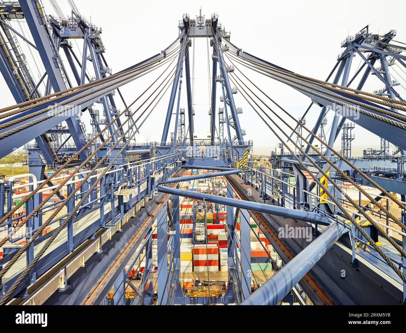 Crane above cargo containers on dock Stock Photo - Alamy