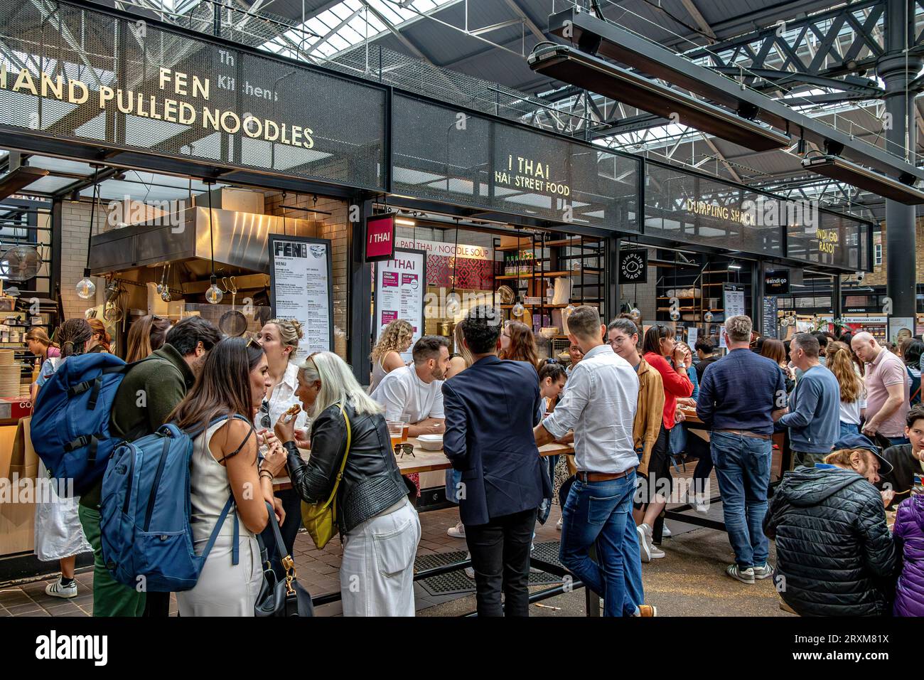 People enjoying food from various food vendors at the food hall in Old ...