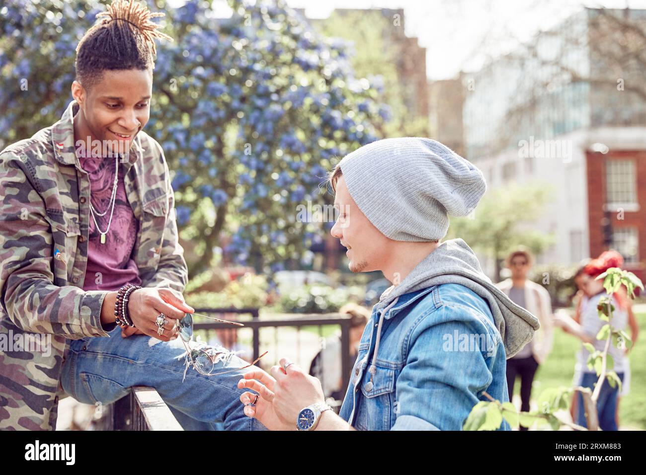 Two teenage boys talking not girls hi-res stock photography and images ...