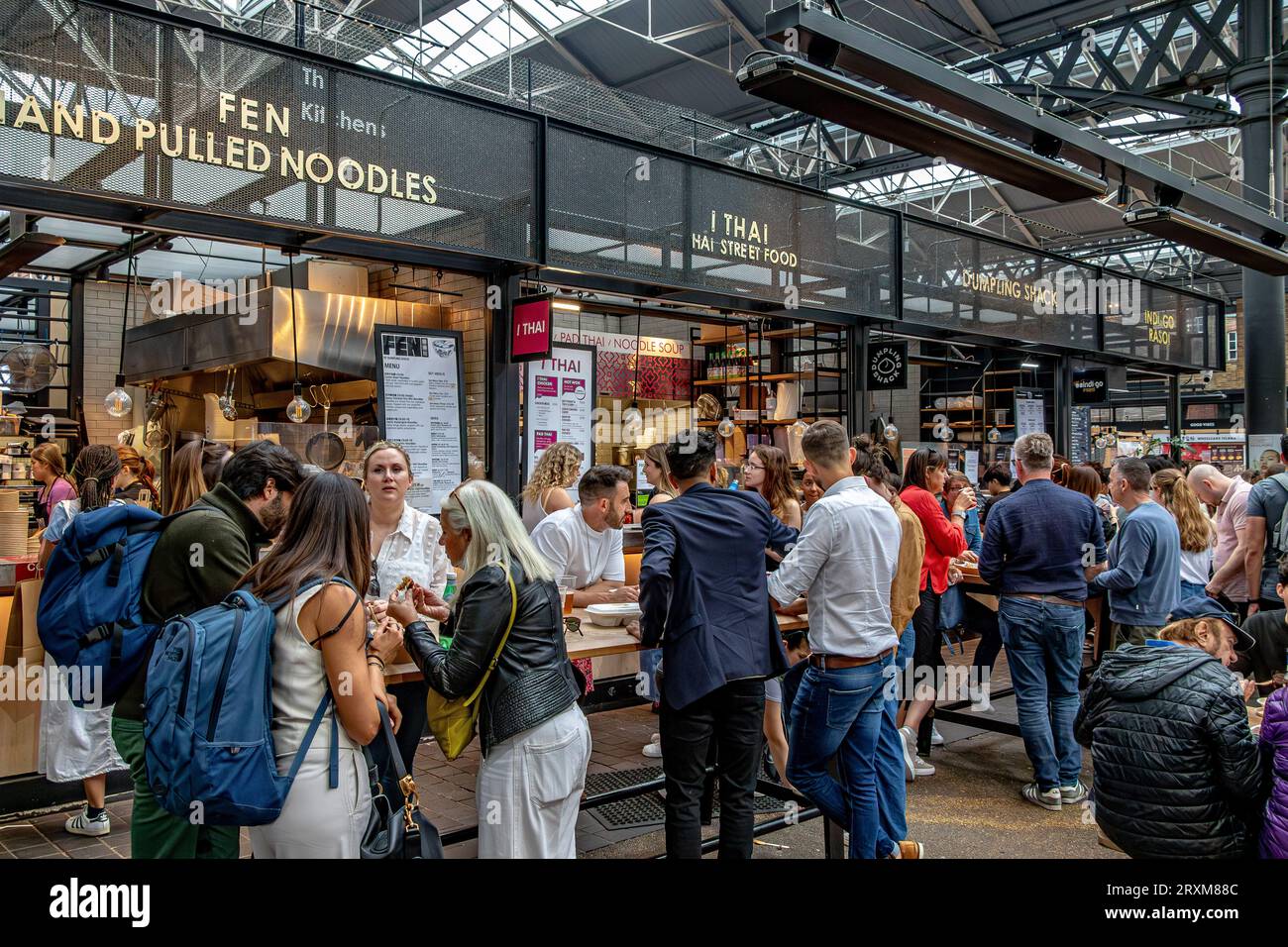 People enjoying food from various food vendors at the food hall in Old ...