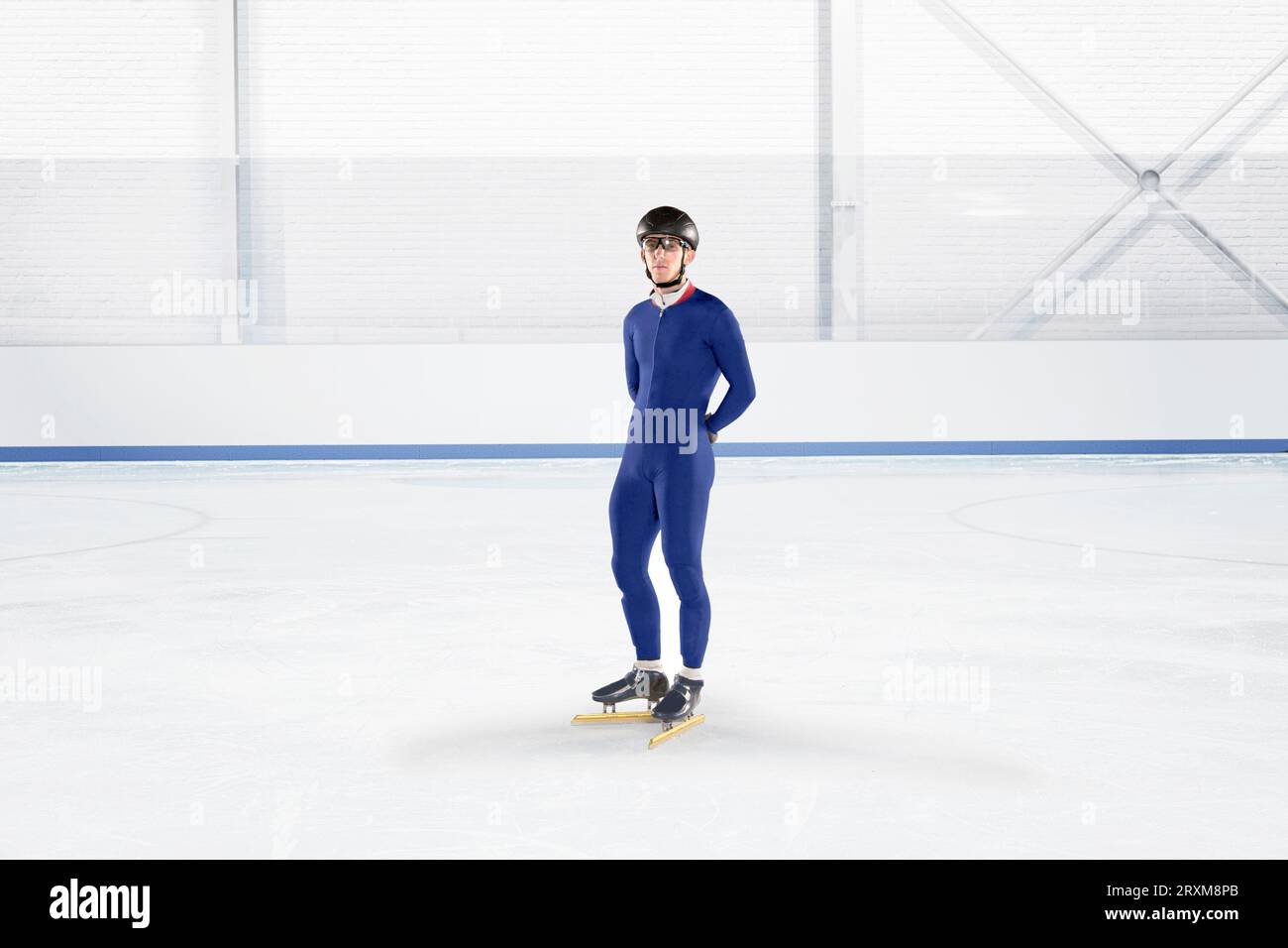 Speed skater in blue uniform at ice rink Stock Photo - Alamy