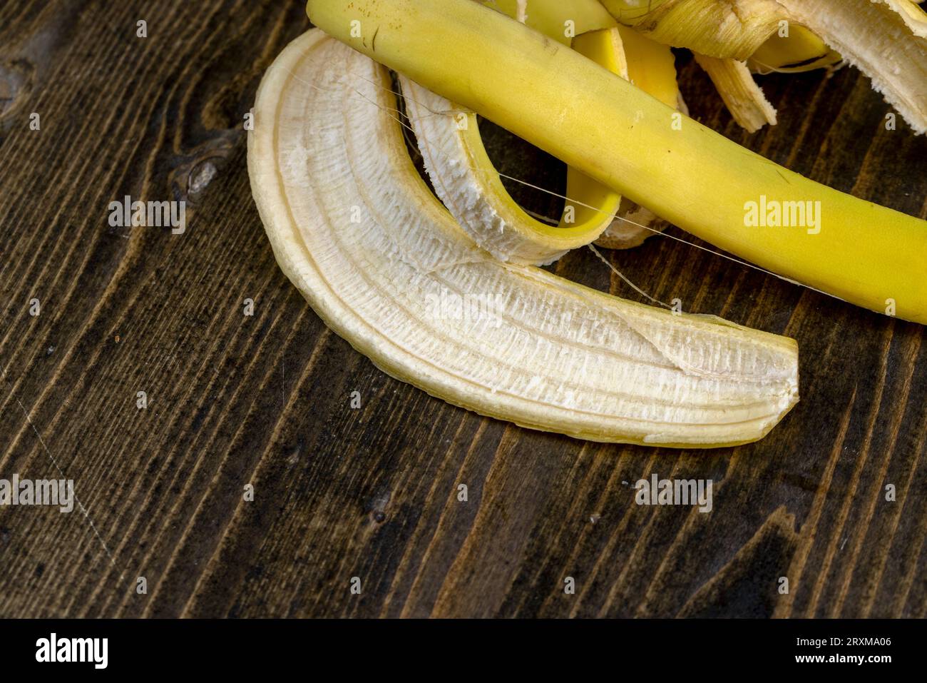 discarded yellow banana peel after picking fruits and banana pulp ...