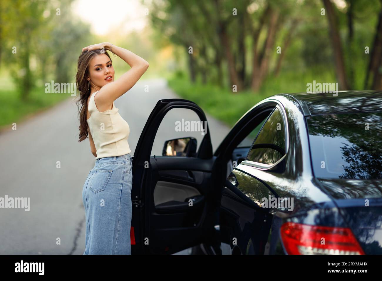 Happy woman driver at car smiling. Cute young happy brunette female ...