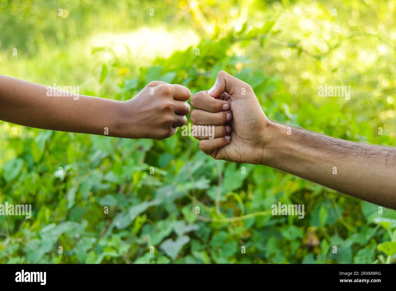 People giving a punch, fight for rights, friendly greeting. Asian girl ...