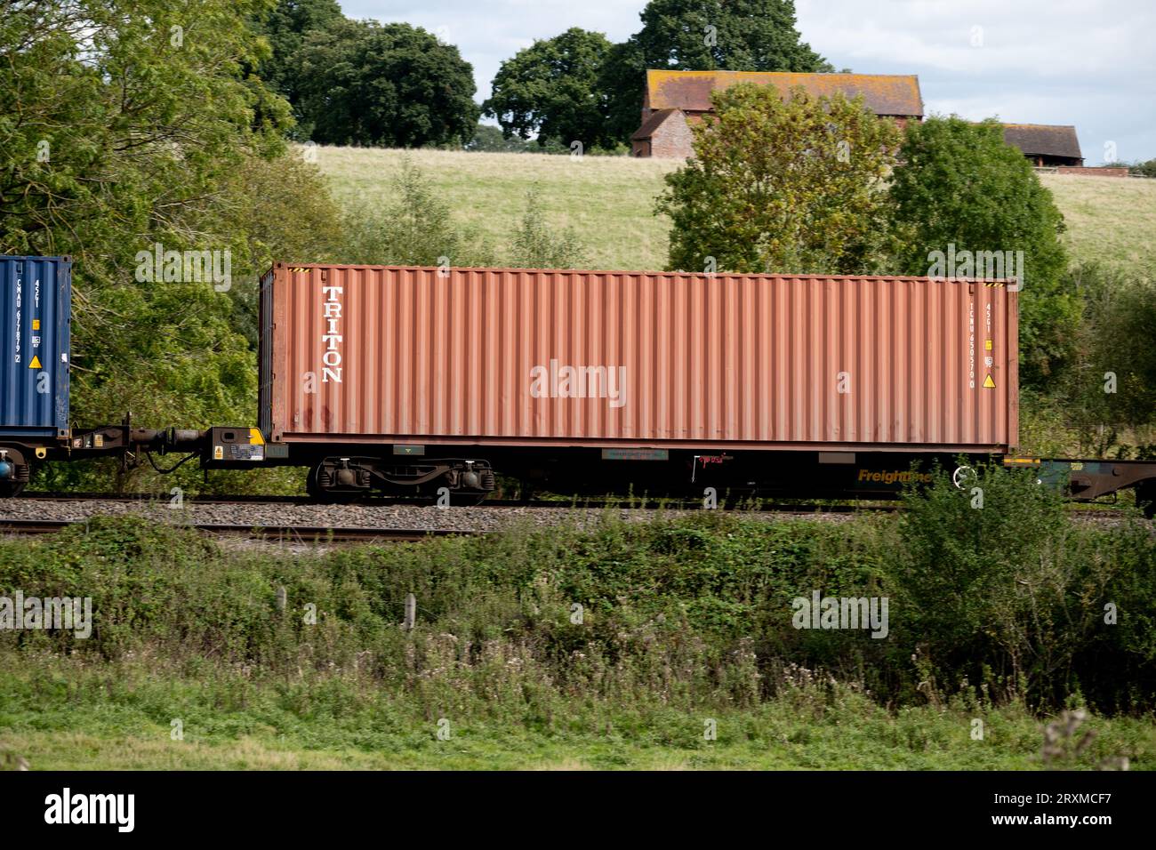 Triton shipping container on a freightliner train, Warwickshire, UK ...