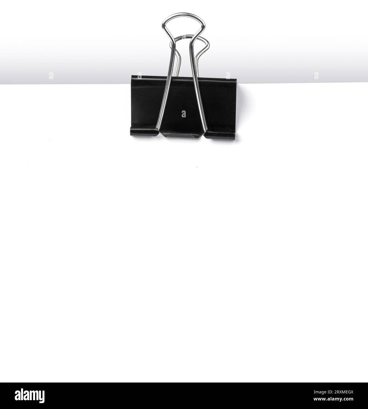 white sheet of paper with iron clothespin . copy space. with clipping ...