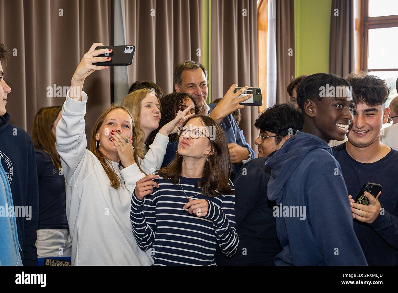 Prime Minister Alexander De Croo poses with pupils at a visit to the SFI Melle, Sint-Franciscus ...