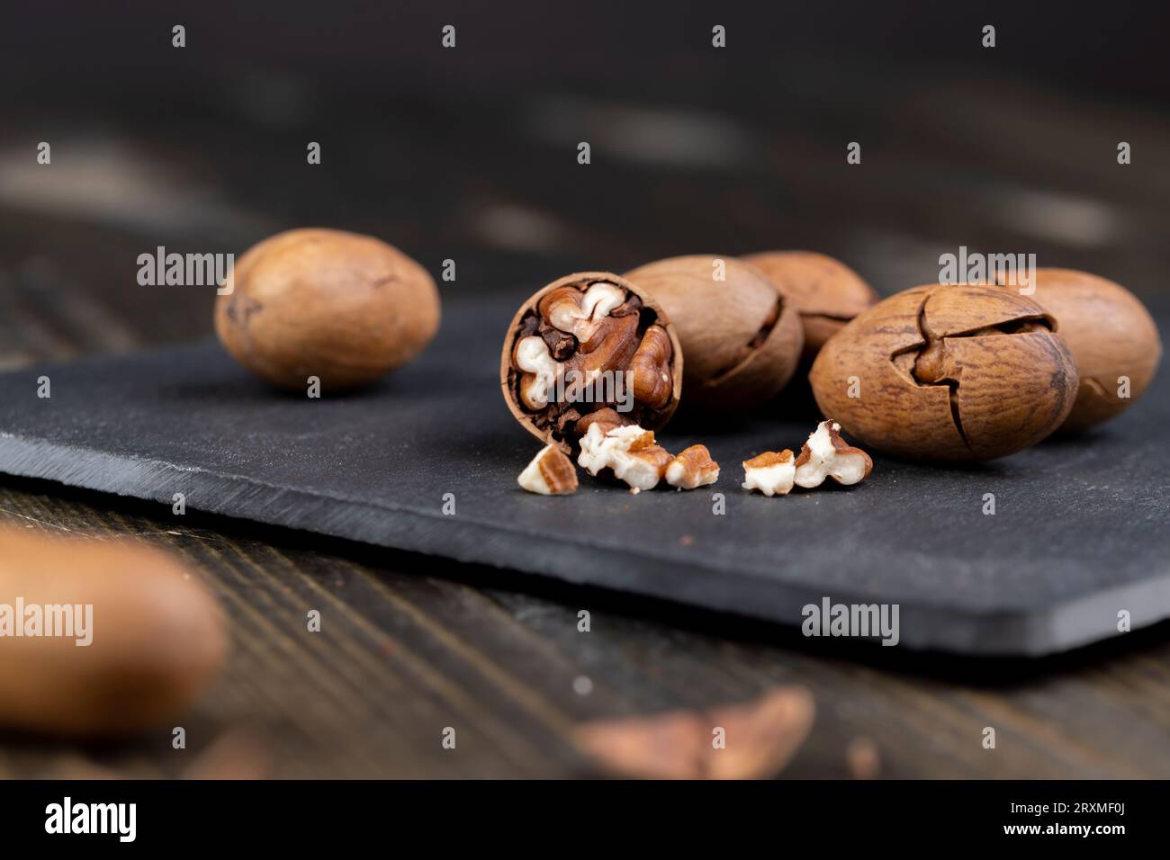 fresh crop of pecans on the surface, a few fresh and crispy pecans ...