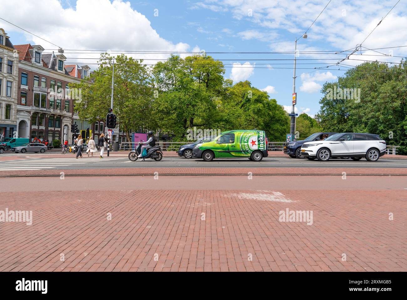 Amsterdam, Nederland - July 20, 2023: Closeup view of van carrying Heineken beers moves through ...