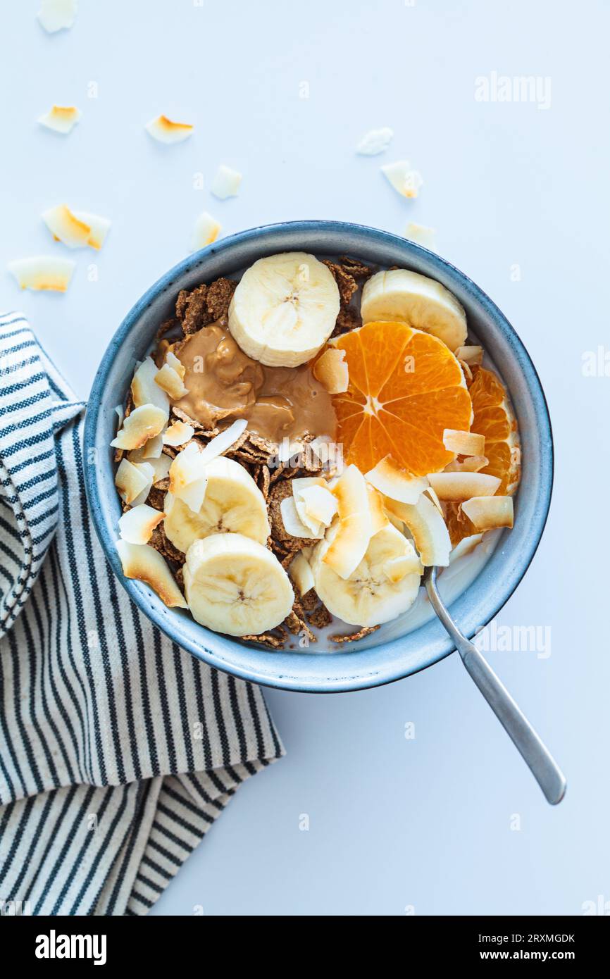 Winter wholewheat breakfast cereals with tangerine, coconut chips ...