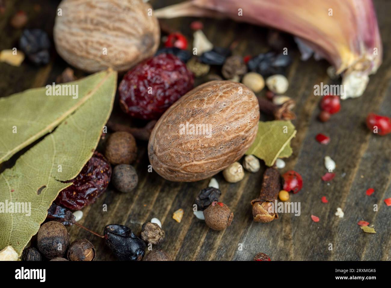 nutmeg and other spices mixed on the table , whole nutmeg spice and ...