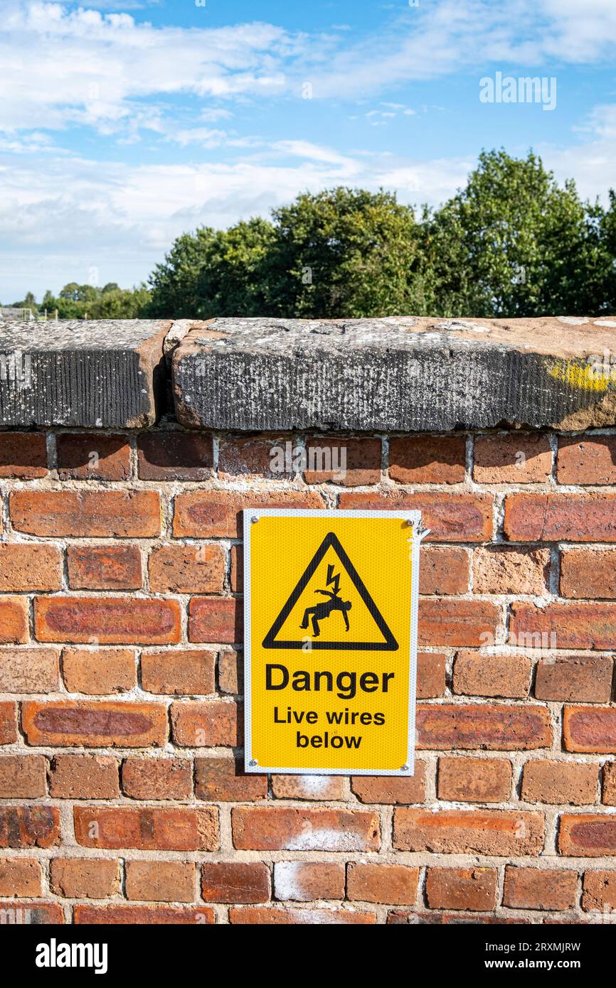 Danger live wires below British rail warning sign on viaduct Stock ...