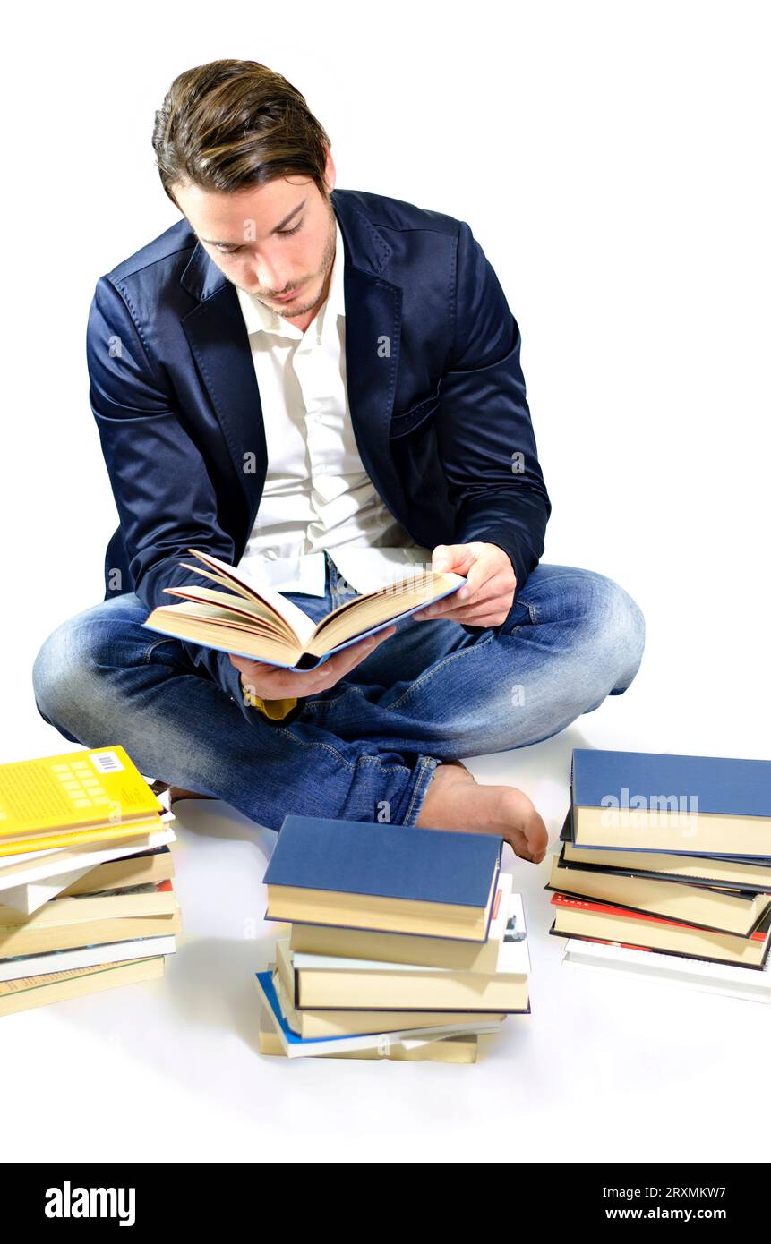 Young adult reading books, sitting on white background in casual ...