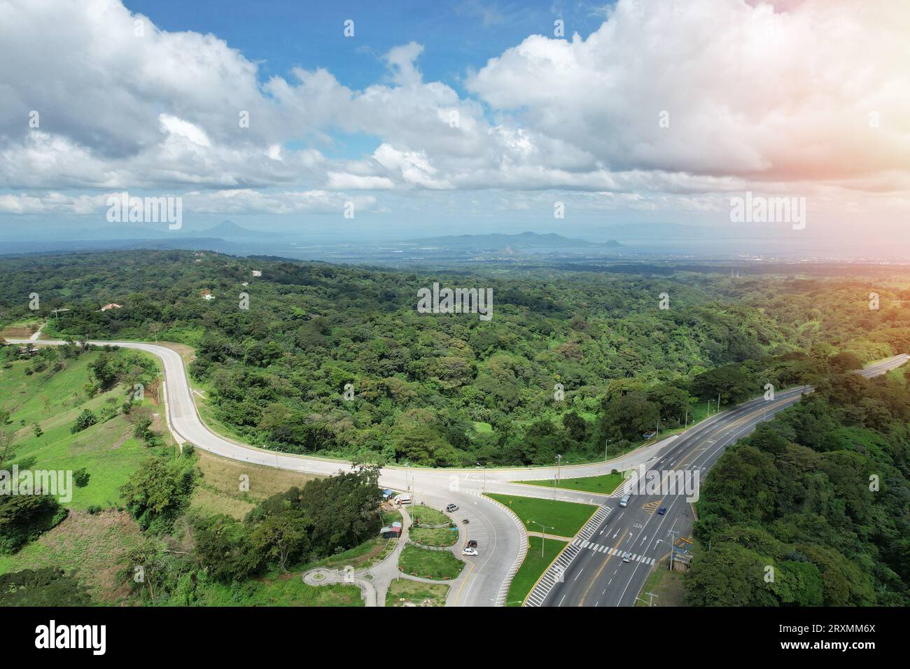 Sunny green Nicaragua landscape with new road to Managua aerial drone ...