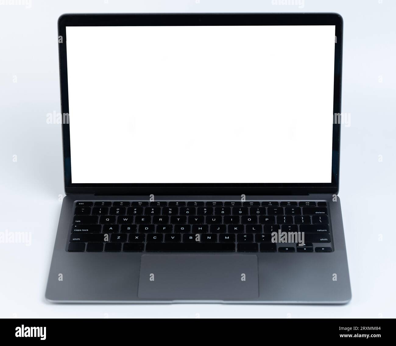 Grey laptop with black keyboard front view isolated on studio ...
