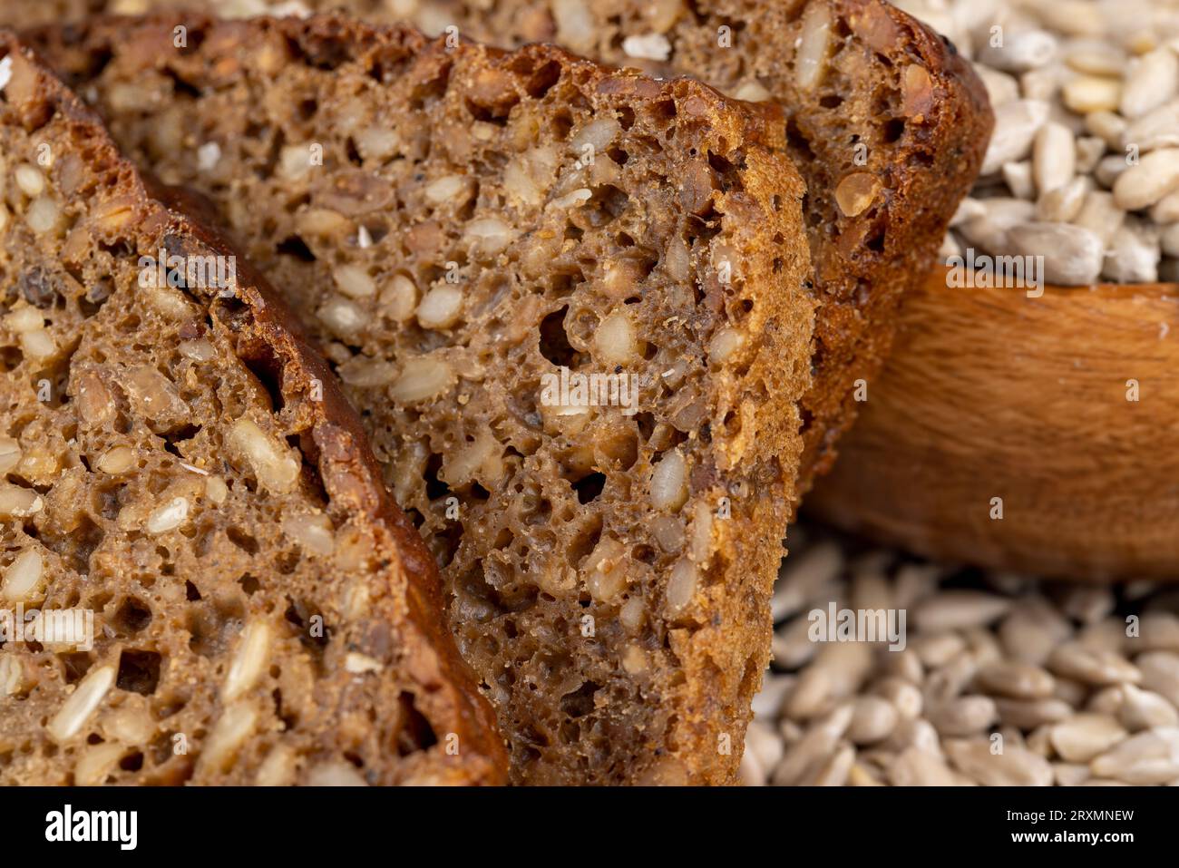 Black rye bread cut into chunks with sunflower seeds, a loaf of bread ...