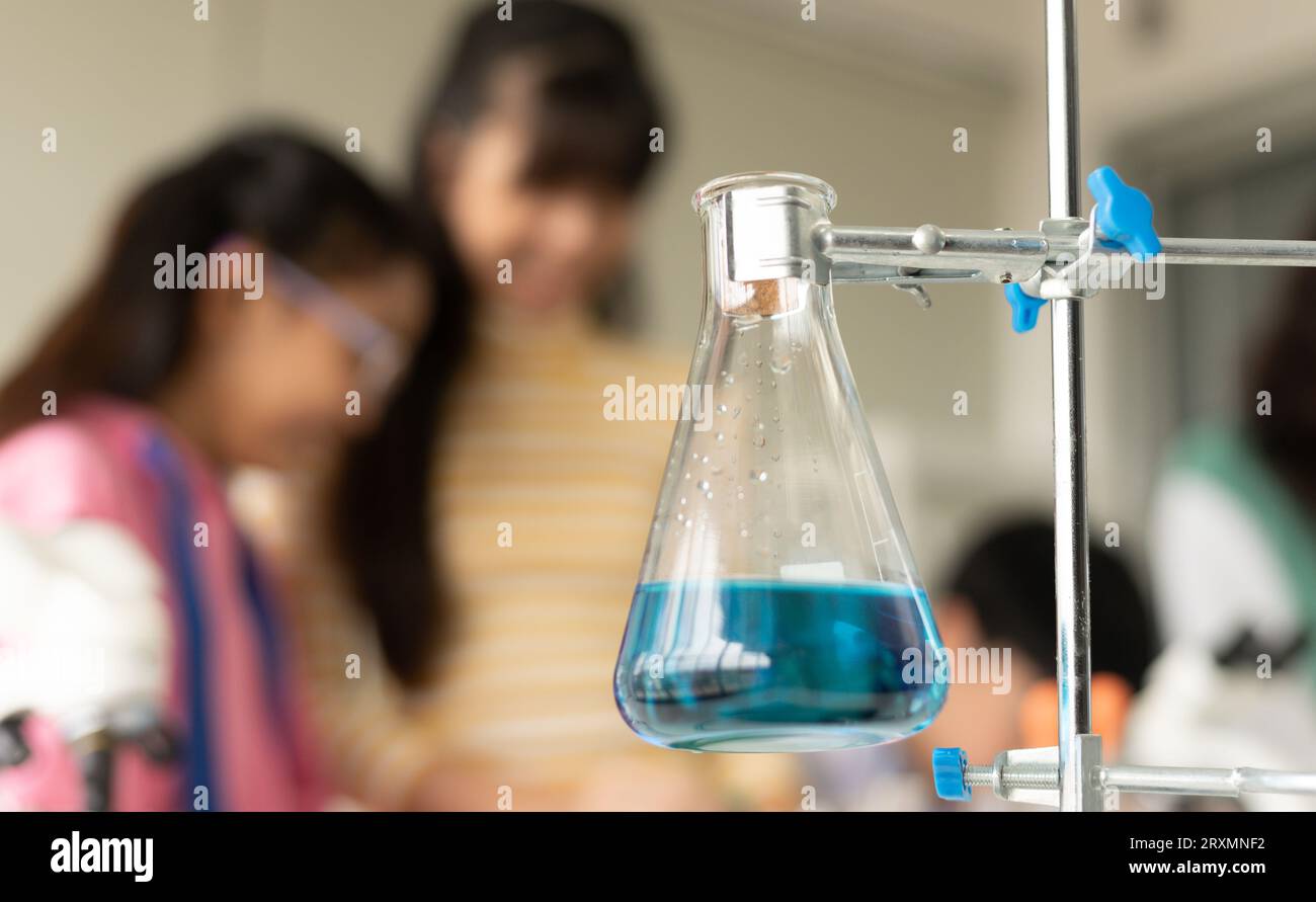 Children scientist doing science experiment test with chemistry in a ...