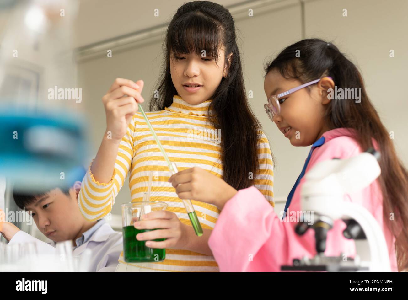 Children scientist doing science experiment test with chemistry in a ...