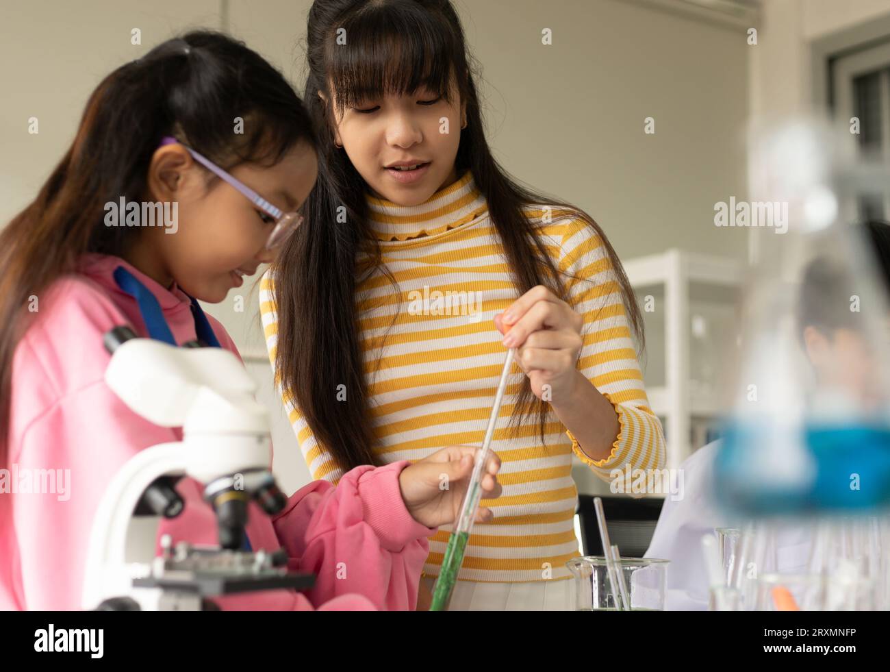 Children scientist doing science experiment test with chemistry in a ...