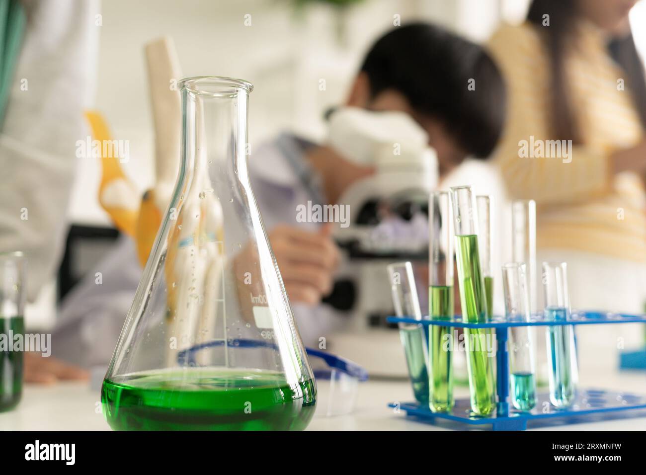 Children scientist doing science experiment test with chemistry in a ...