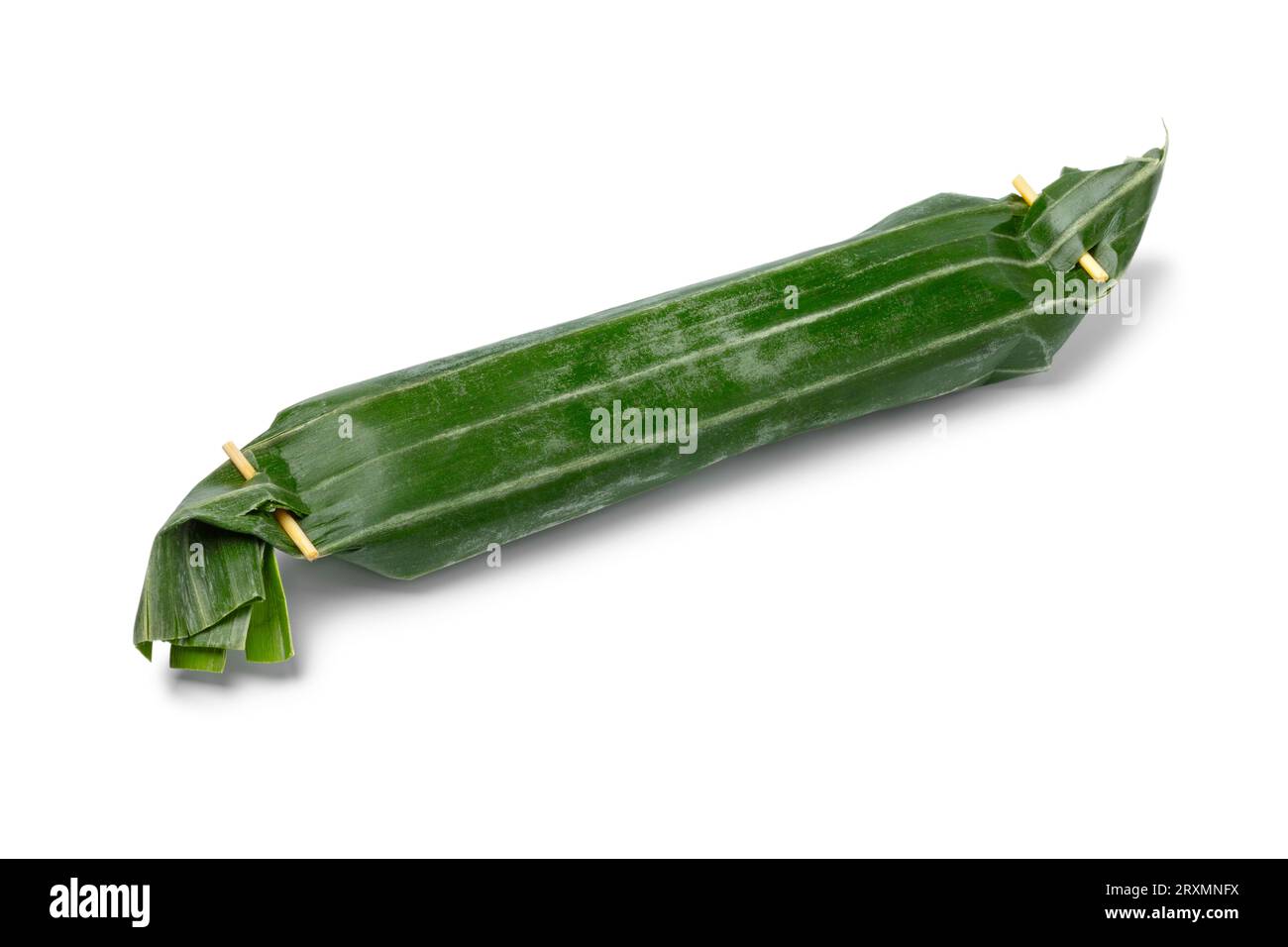 Single whole Lemper wrapped in banana leaves, an Indonesian savoury ...