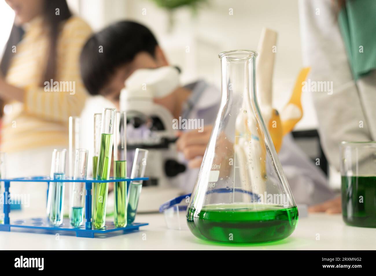 Children scientist doing science experiment test with chemistry in a ...