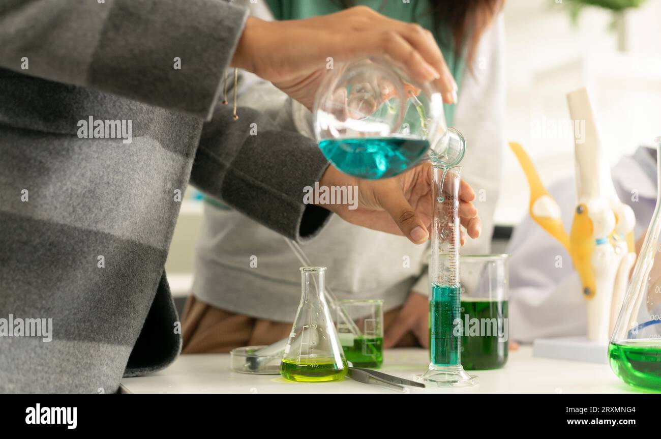 Children scientist doing science experiment test with chemistry in a ...