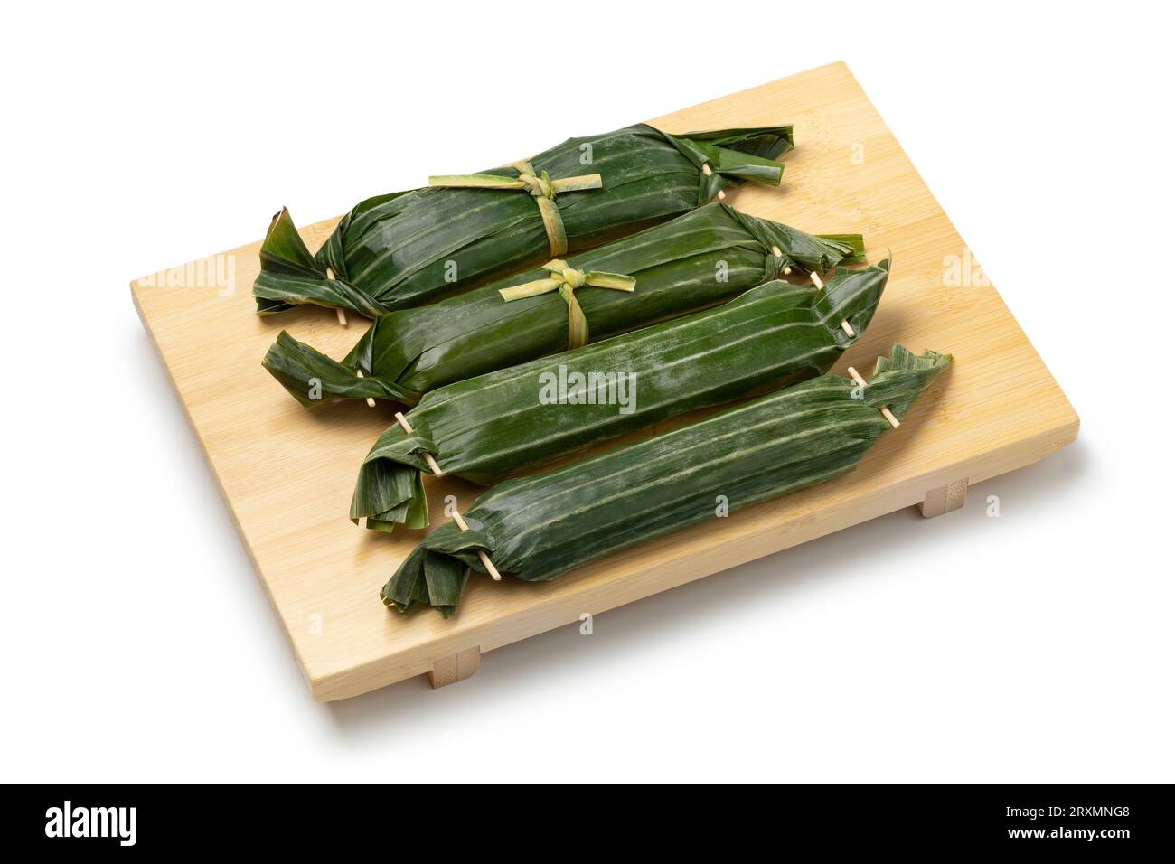 Fresh homemade Lemper wrapped in banana leaves, an Indonesian savoury ...