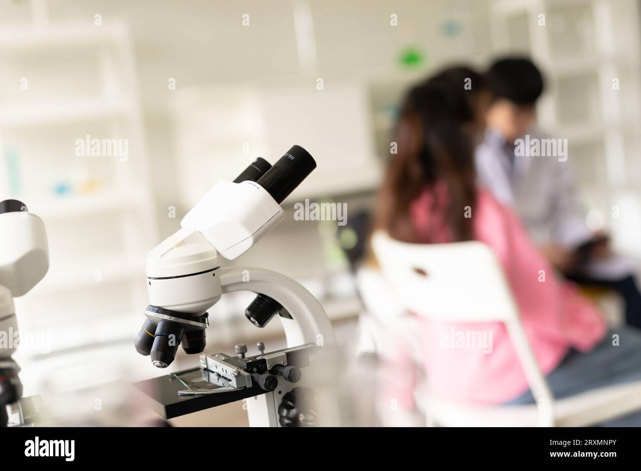 STEM education concept. Asian children in laboratory research an ...