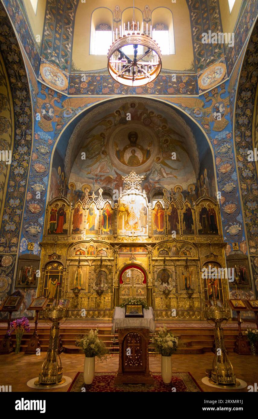 Looking up at images and paintings on the vaults of the altar apse at ...