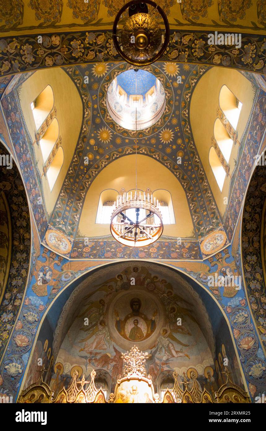 Looking up at images and paintings on the vaults of the altar apse at ...