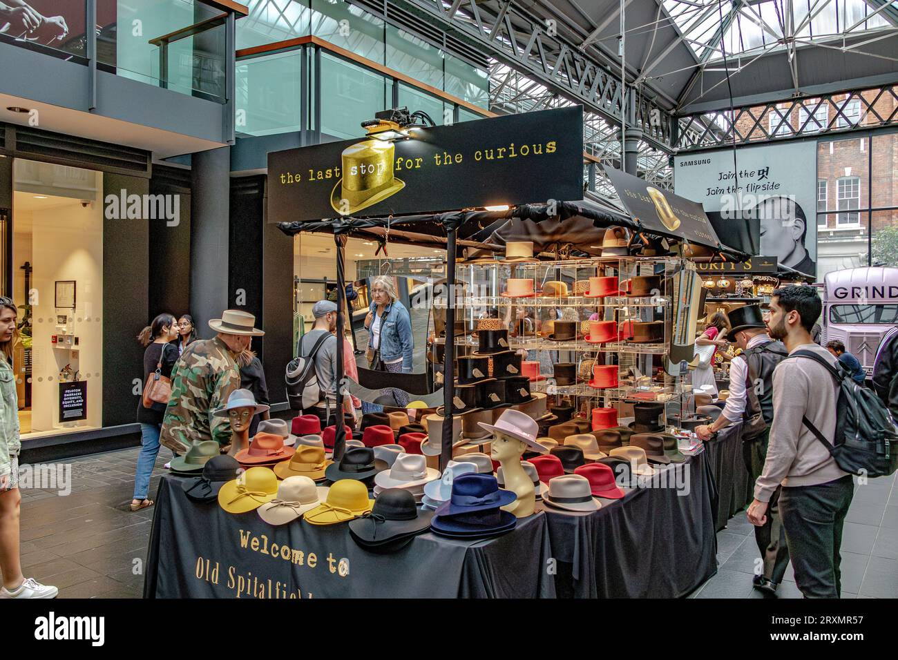 People browsing a hat stall at Old Spitalfields Market, London E1 Stock ...